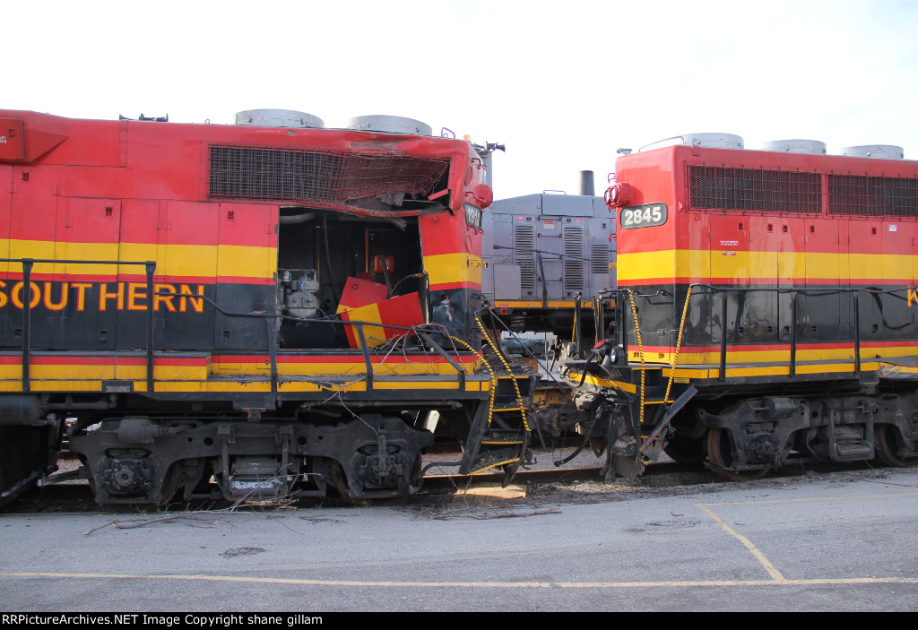 KCS 2845 Both Wrecked unit's from the side.